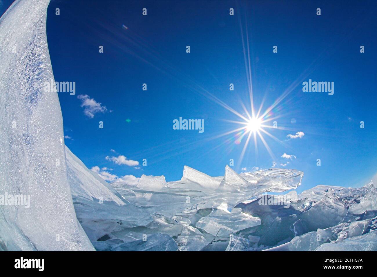 Ice on blue sky background Stock Photo - Alamy