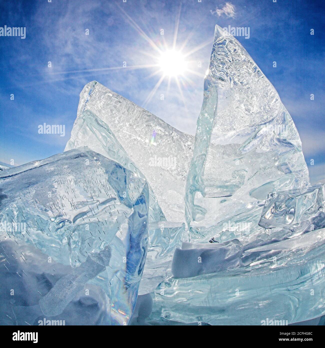 Ice on blue sky background Stock Photo - Alamy