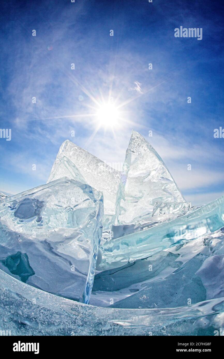 Ice on blue sky background Stock Photo - Alamy