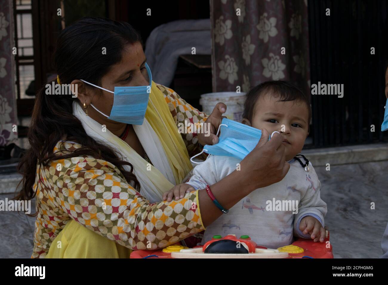 Dehradun, Uttarakhand/India - August 14 2020 : Indian mother is wearing ...
