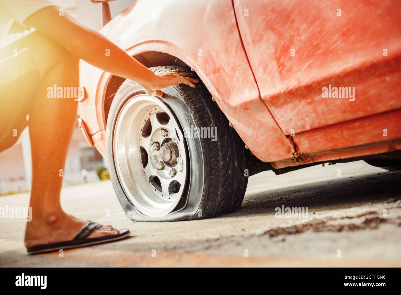 Man fixing a flat tire hi-res stock photography and images - Alamy