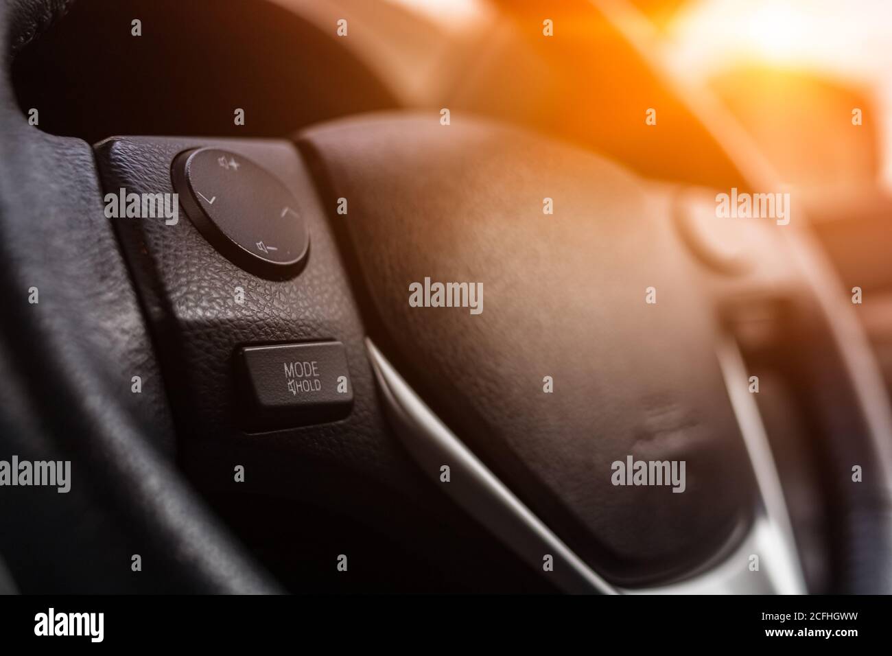 The button in steering wheel in car Stock Photo - Alamy