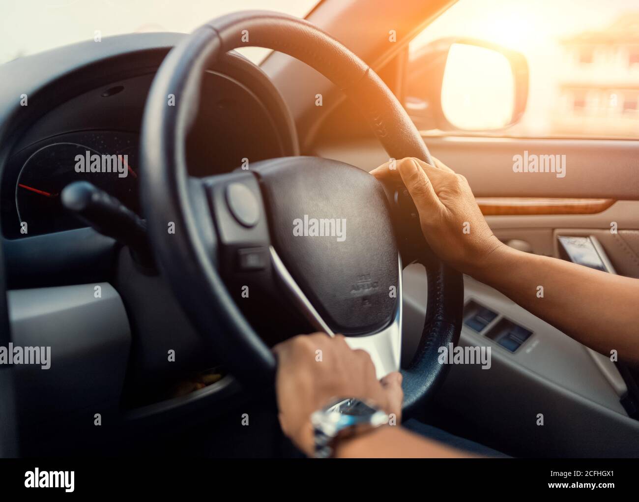 hand man wear watch and drive a car Stock Photo - Alamy