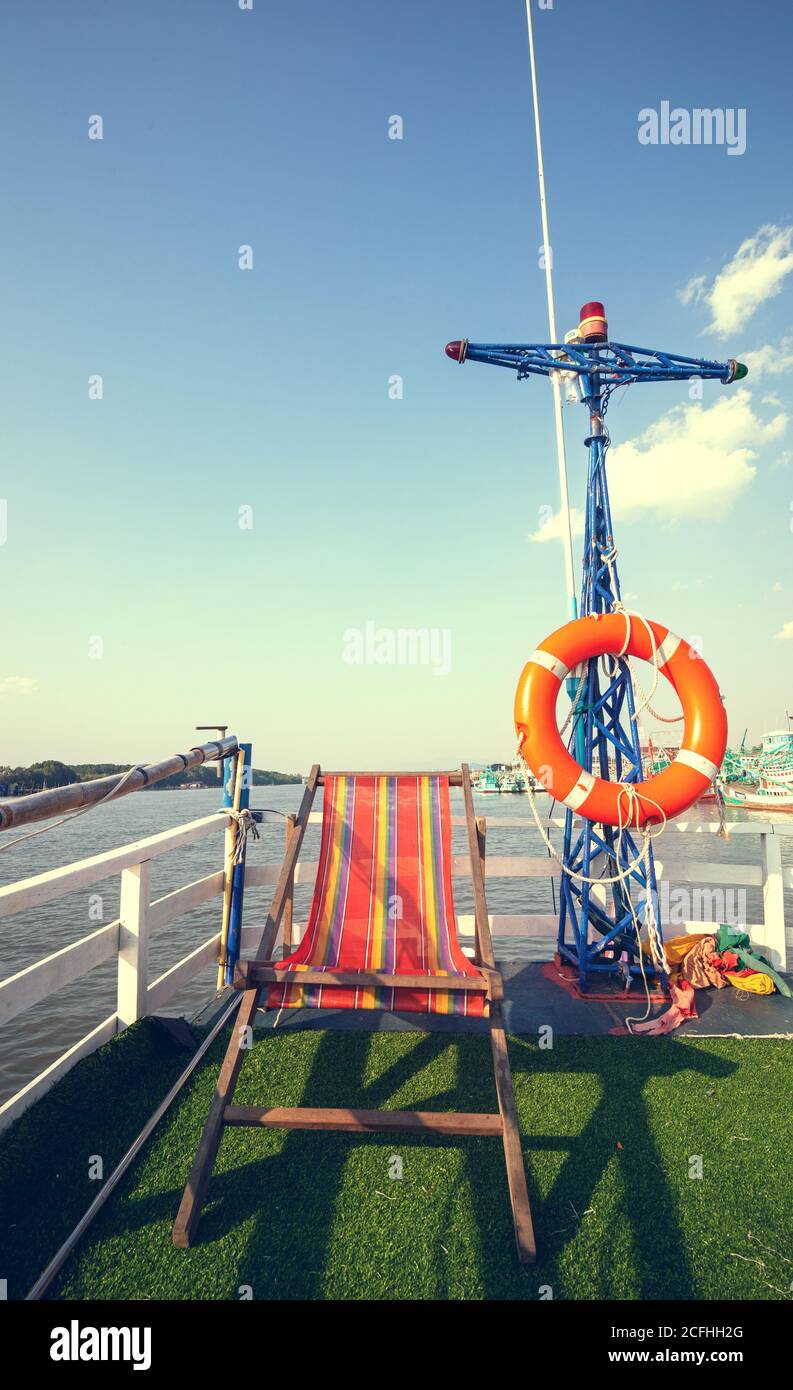 beach chair on boat terrace for sunbathe midday Stock Photo - Alamy
