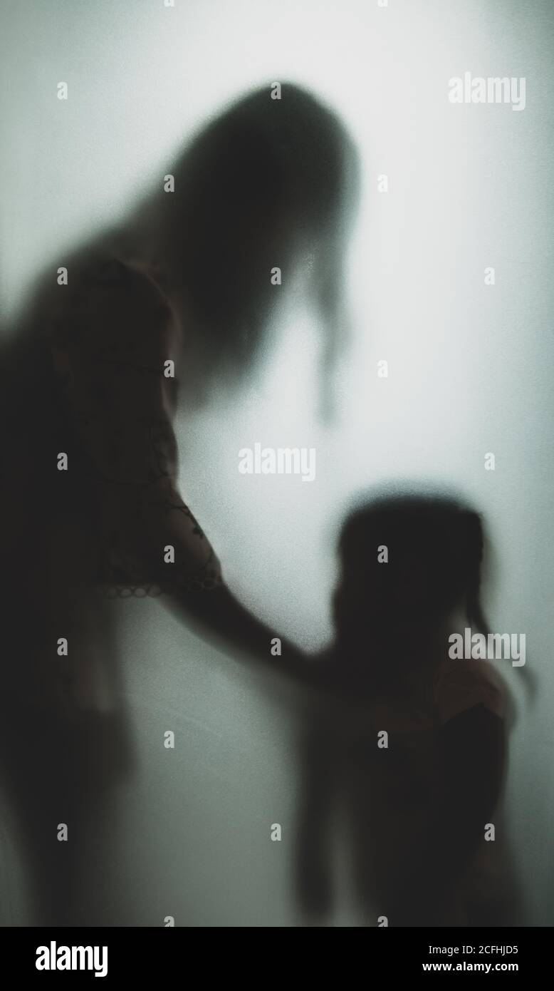 Ghost concept shadow of mother who is strangling the neck of the child ...