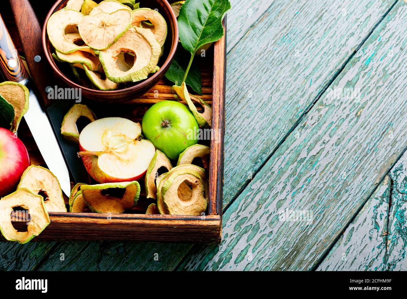Sun-dried apple slices or apple chips and fresh apple Stock Photo - Alamy