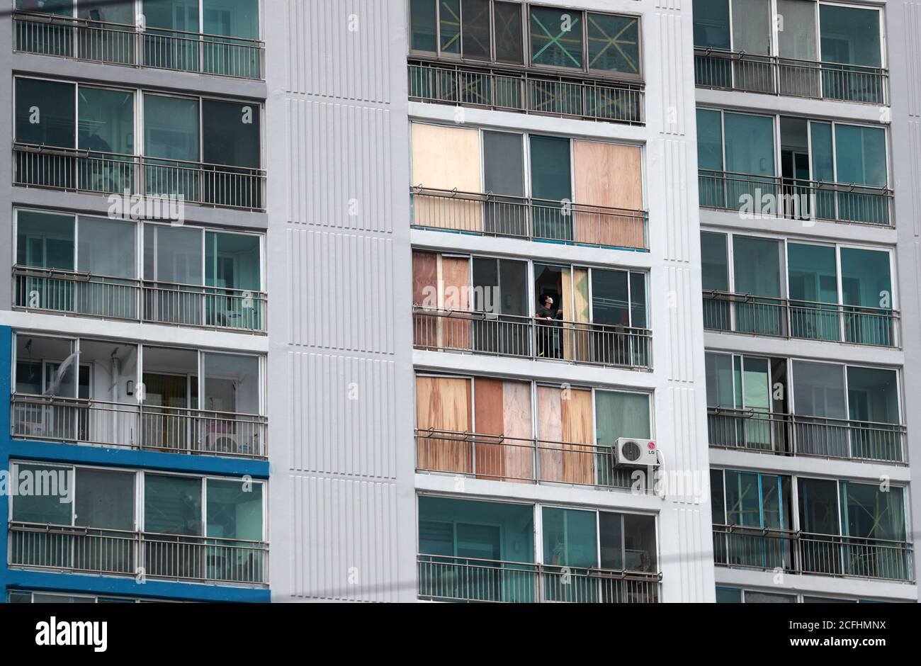 06th Sep, 2020. Boarding up windows ahead of typhoon A resident in ...