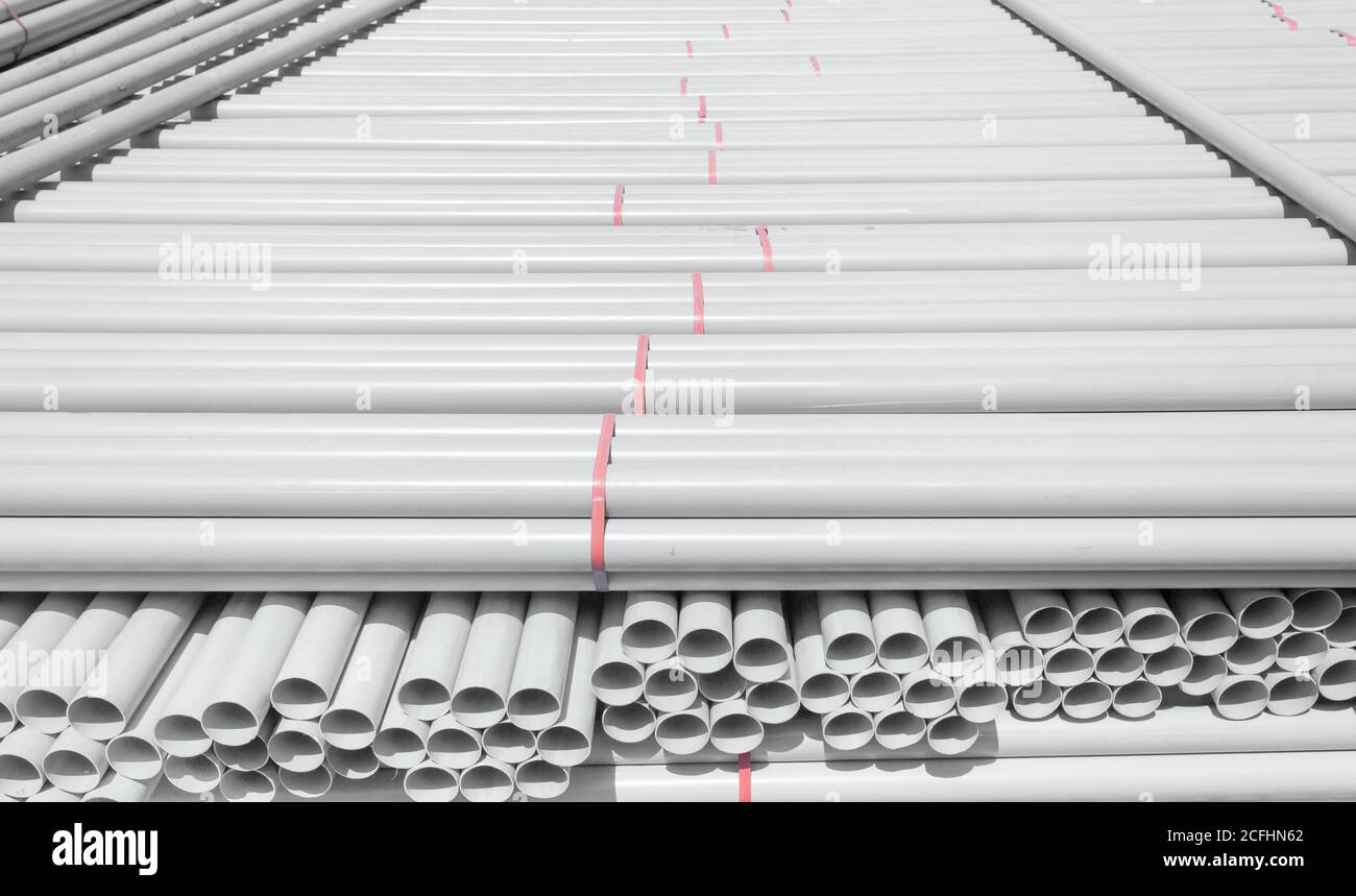 PVC pipes stacked in warehouse Stock Photo - Alamy