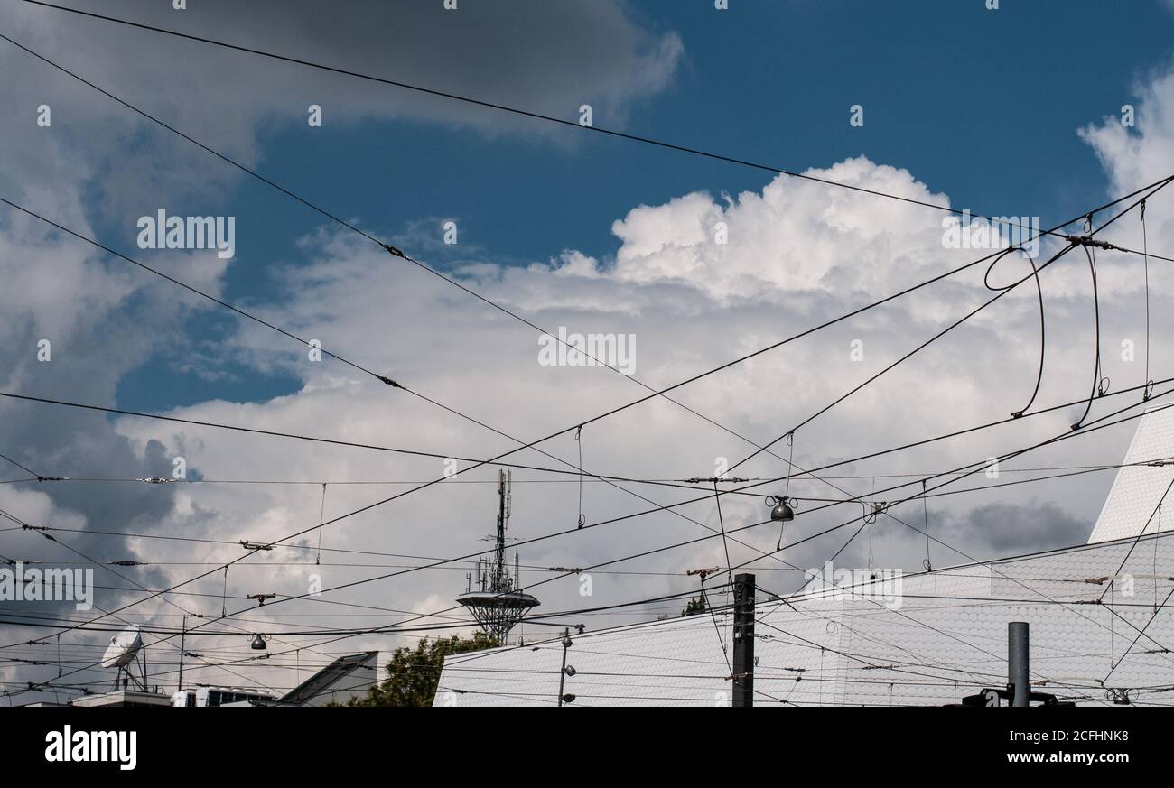 crossing steel cables of the overhead supply lines of a tramway with ...
