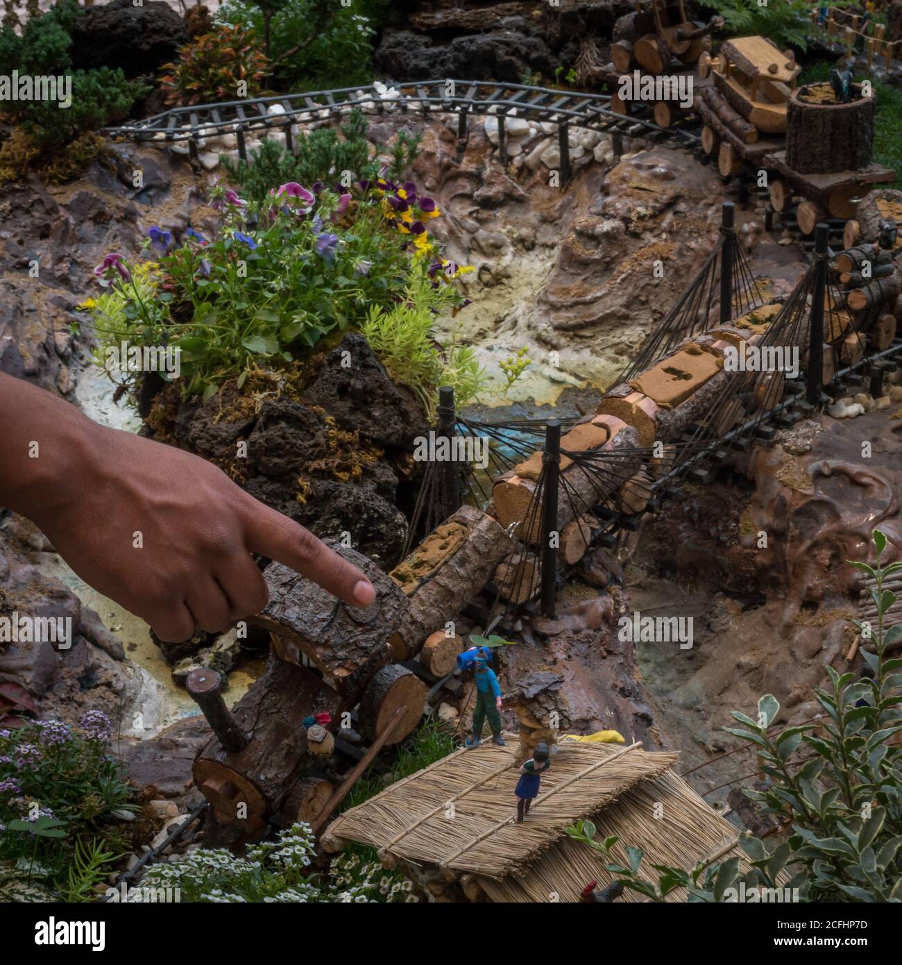 Miniature wooden railway train and working people Stock Photo - Alamy