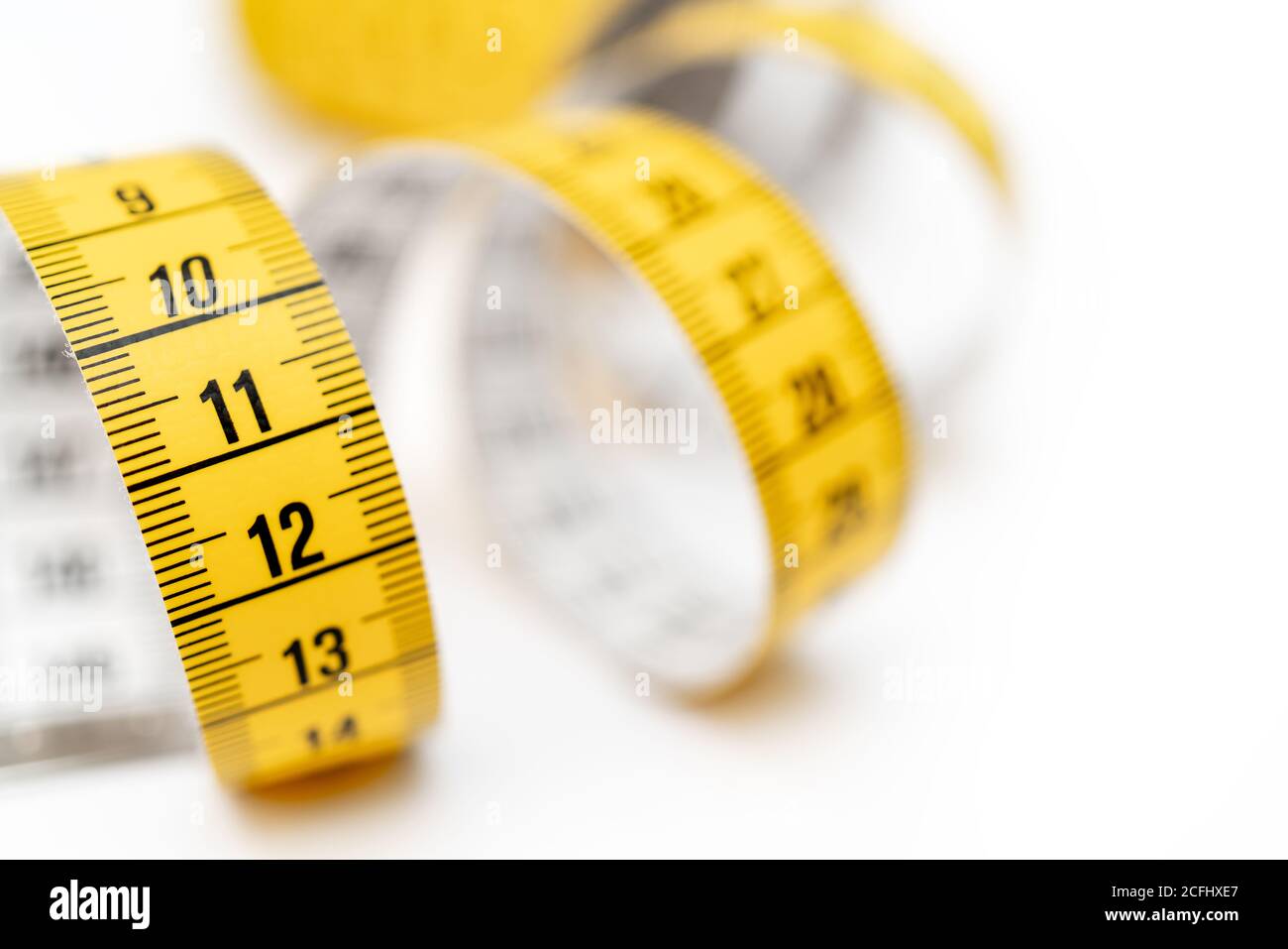 Yellow measuring tape on white background. Measurement of length Stock ...