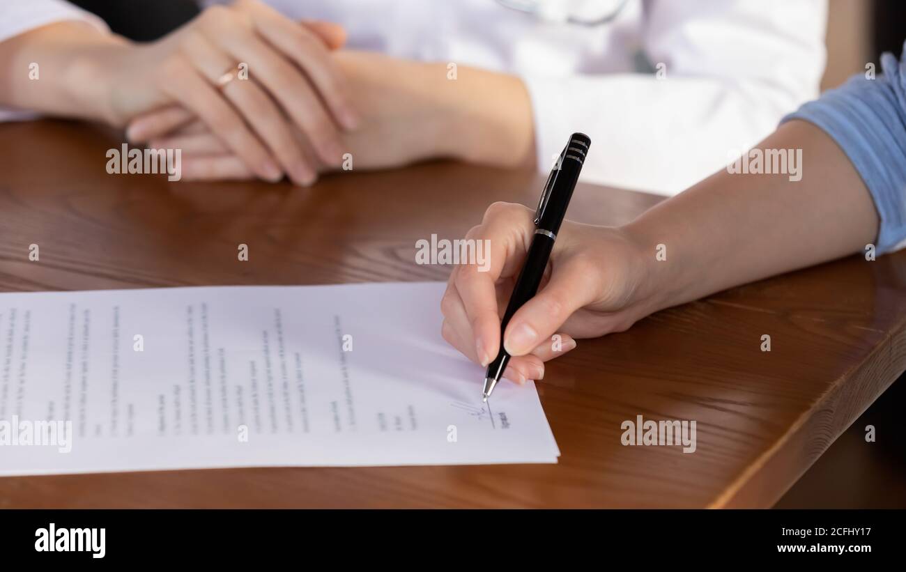 Close up woman signing medical insurance agreement at meeting Stock ...