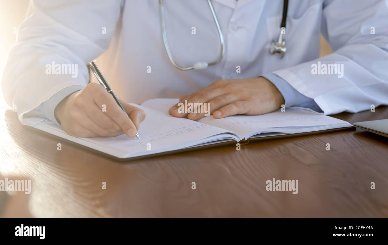 Doctor working documents hi-res stock photography and images - Alamy