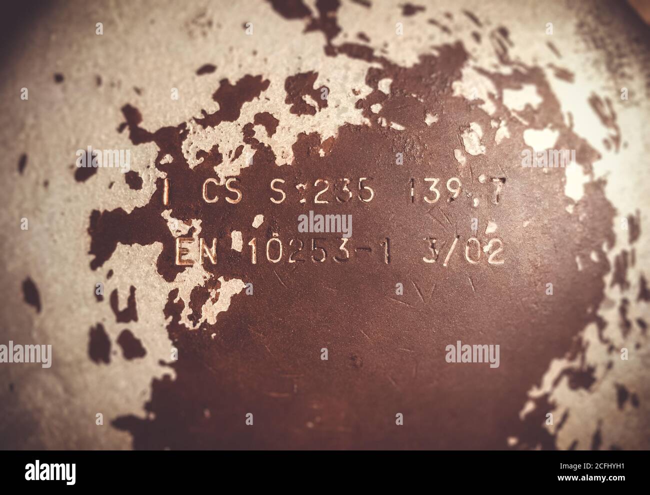 Numbers engraved on an old industrial metal plate. Background texture ...