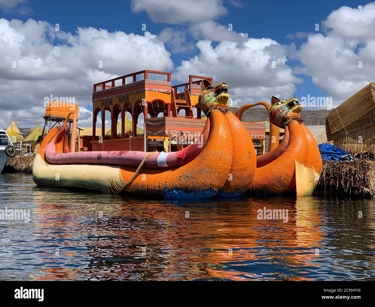 Uros Floating Island on Titicaca Lake, Puno, Peru. View on orange ...