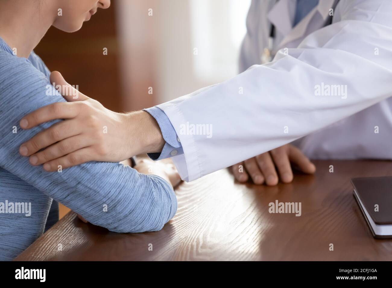 Close up caring doctor therapist touching female patient hand Stock ...