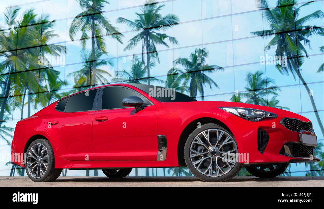 Low angle shot of a modern red car Stock Photo - Alamy