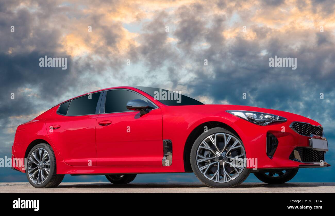 Low angle shot of a modern red car Stock Photo - Alamy