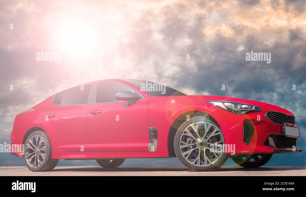 Low angle shot of a modern red car Stock Photo - Alamy