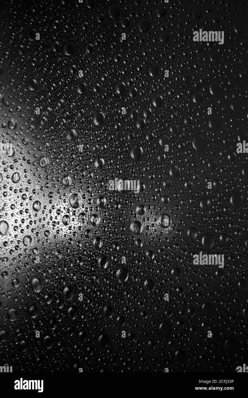 reflections on a grained texture black surface Stock Photo - Alamy