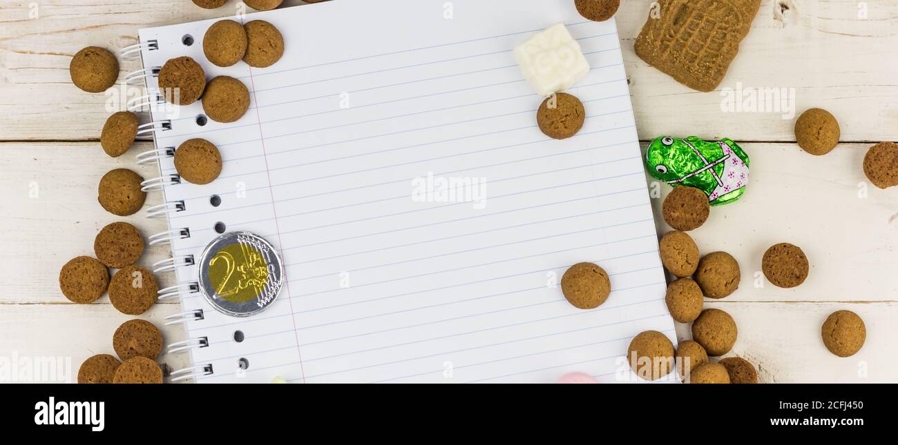 Panorama of a notepad and traditional dutch candy for celebration of ...