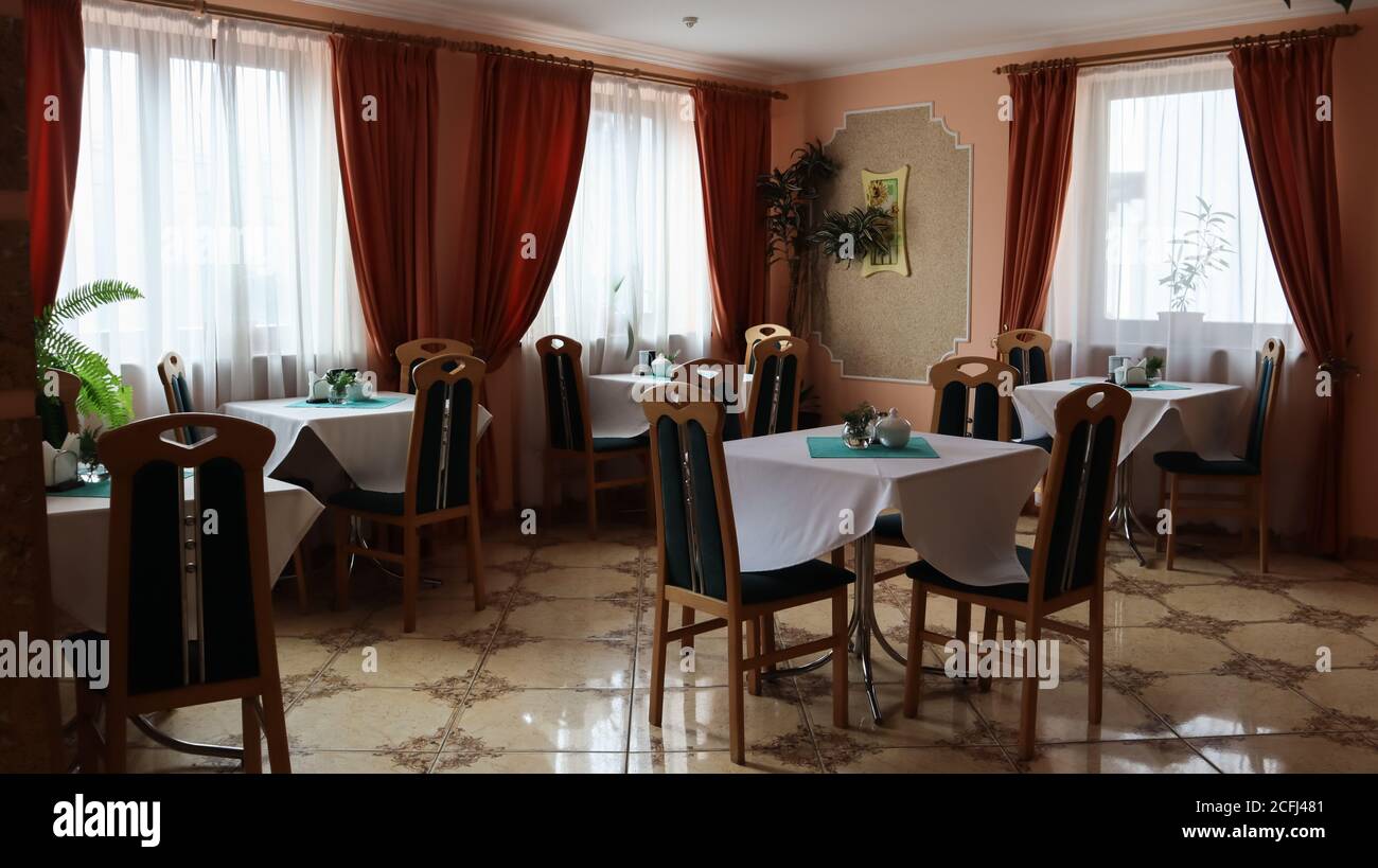 Served tables for breakfast in the cafe, restaurant or hotel dining ...