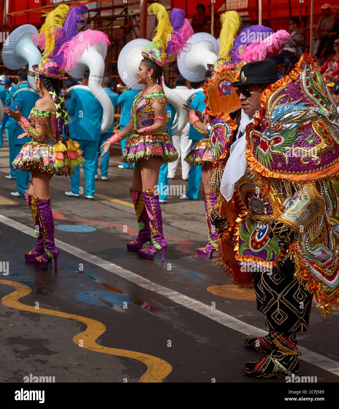 Morenada dancers in ornate costumes parade through the mining city of ...