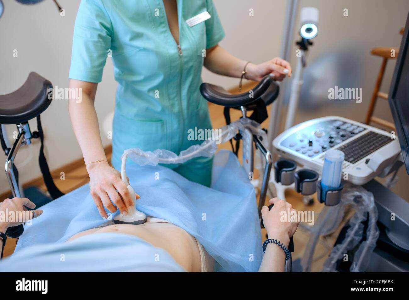 Female gynecologist makes ultrasound scan Stock Photo - Alamy