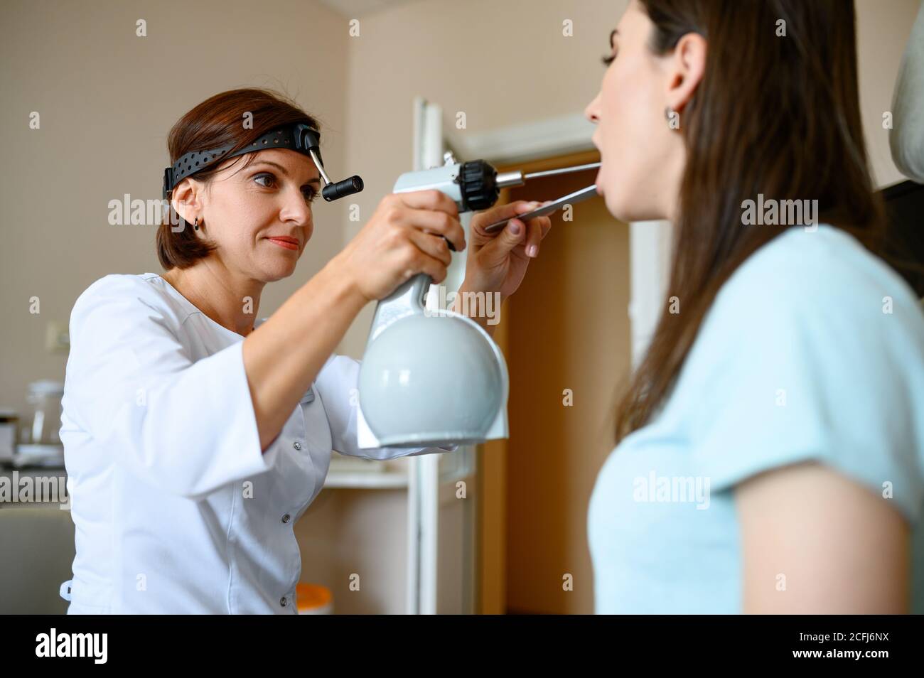 Female ent doctor and patient in office, exam Stock Photo - Alamy