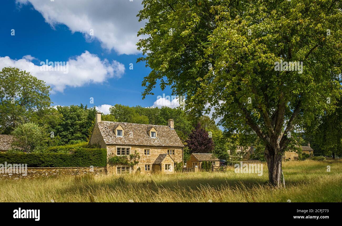 Cotswold stone cottage in the small village of Wyck Rissington Stock ...