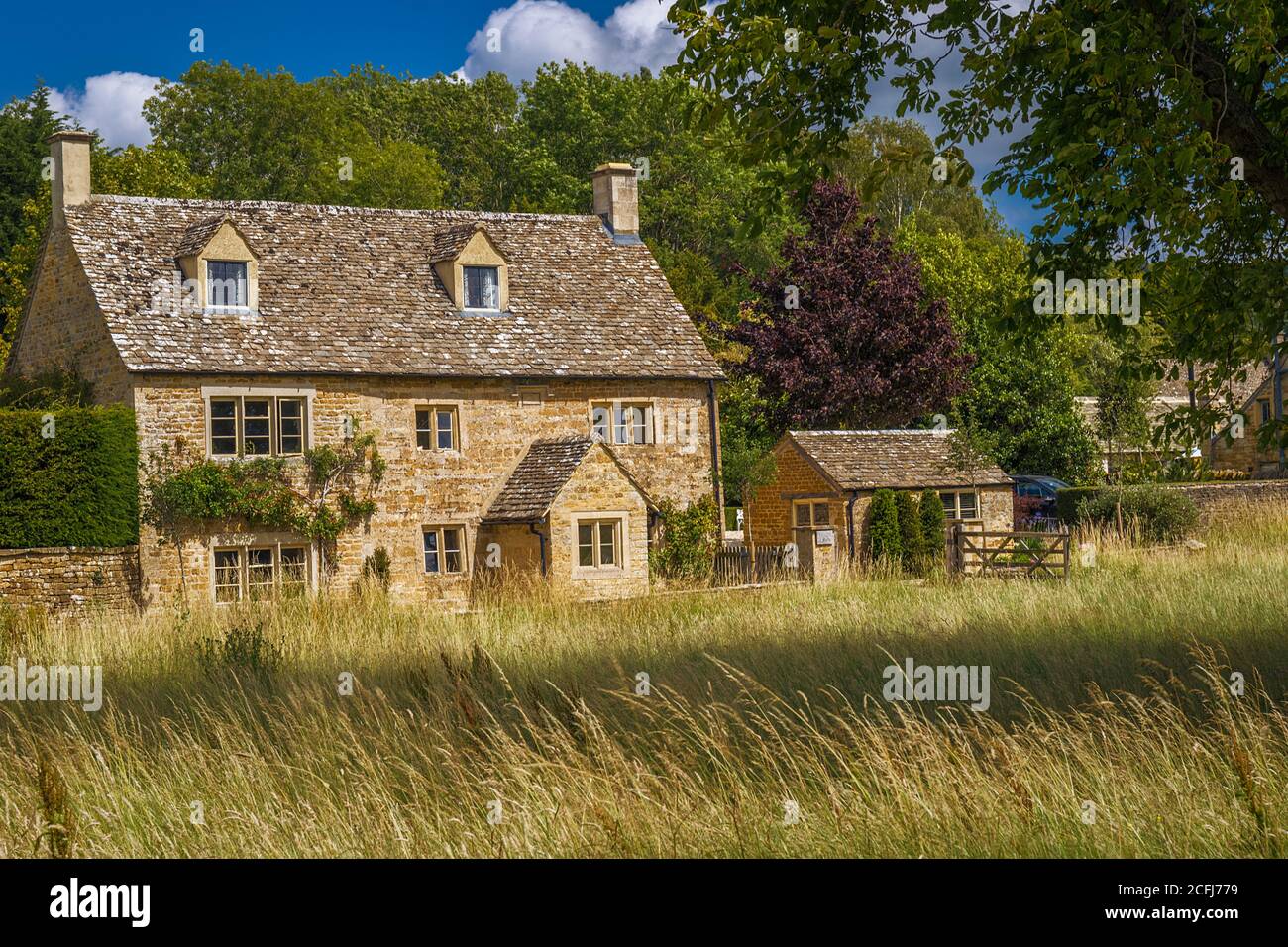Cotswold stone cottage in the small village of Wyck Rissington Stock ...