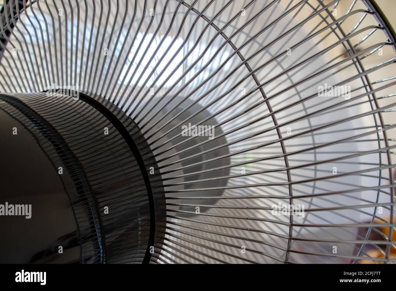 Roma. The blades of a fan spin quickly to relieve the sweltering heat ...