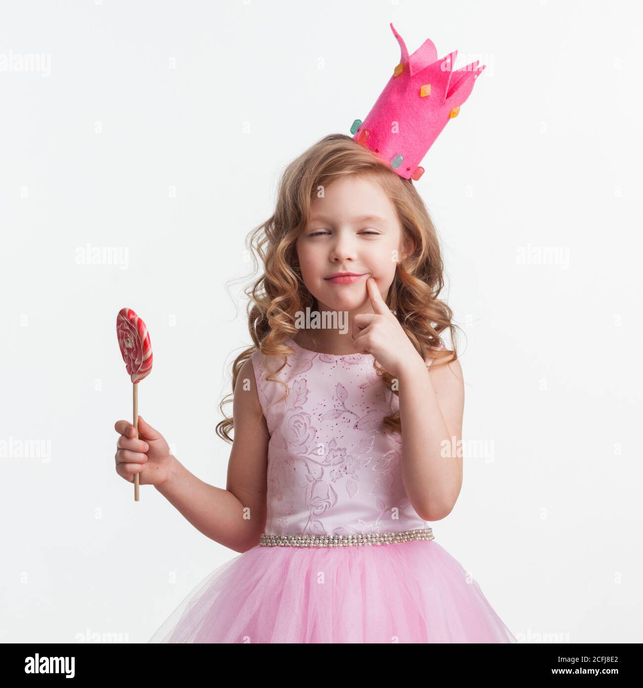 Beautiful excited candy princess girl in crown holding big lollipop and ...