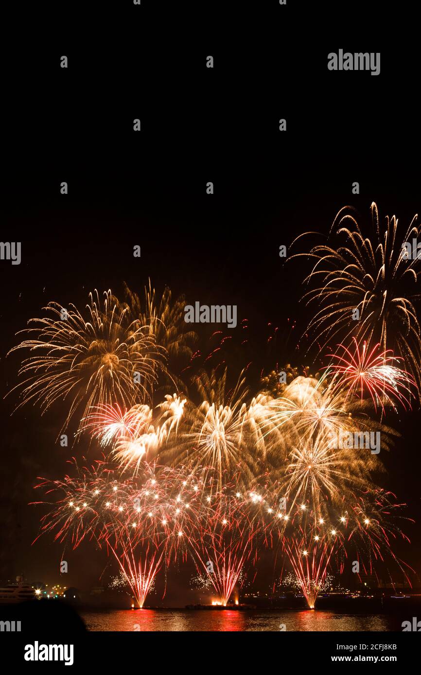 Colorful fireworks in black background Stock Photo - Alamy