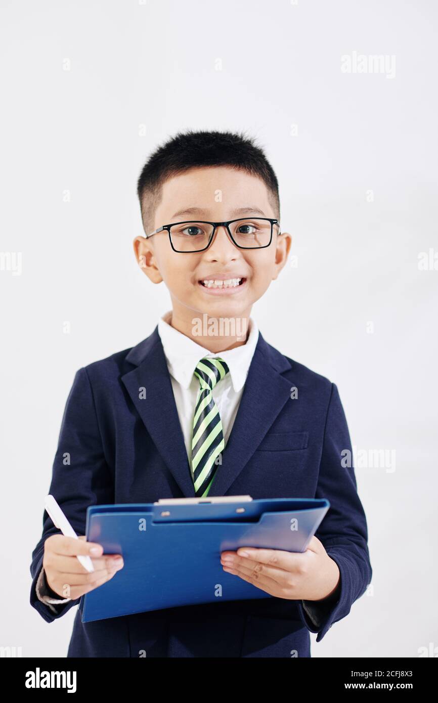 Kid writing in document Stock Photo - Alamy