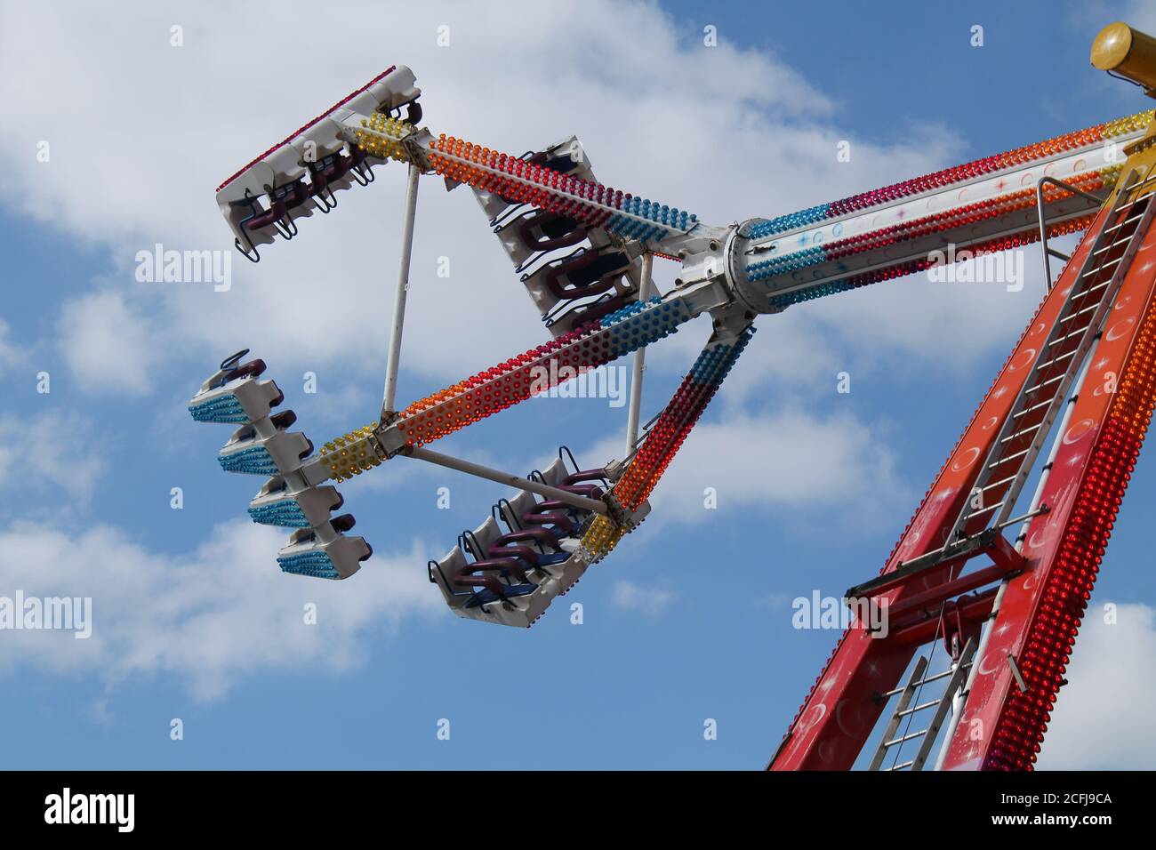 The Carriages and Seats of a High Flying Fun Fair Ride Stock Photo - Alamy