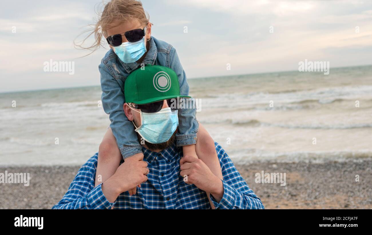 Father carrying daughter shoulders by sea hi-res stock photography and ...