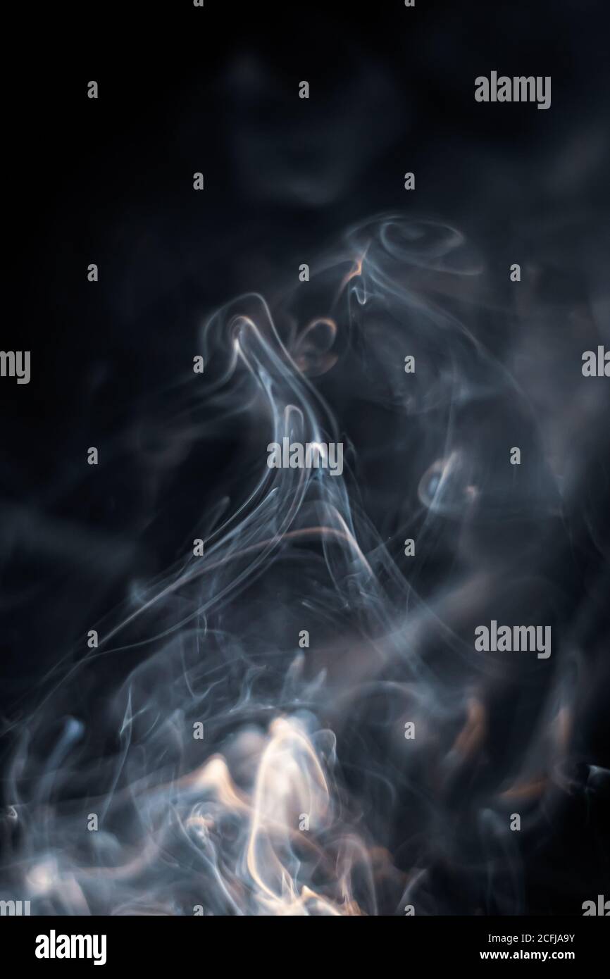 White smoke from incense stick isolated against dark background Stock ...