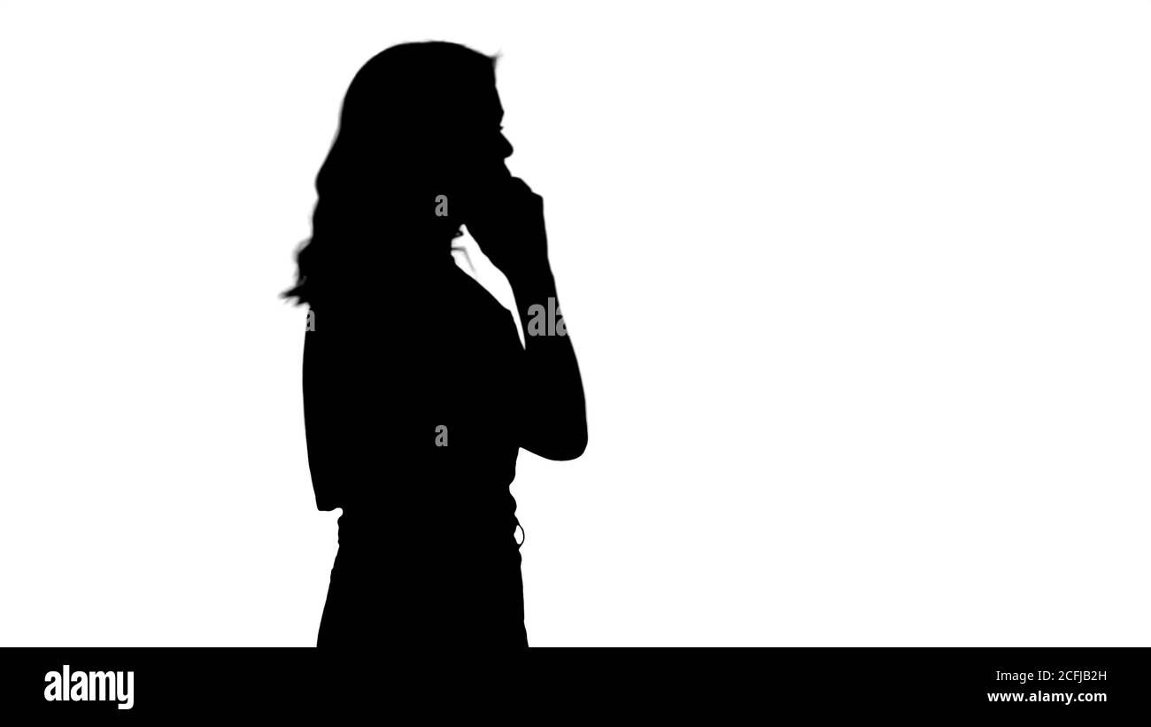 Silhouette Woman talking on the phone Stock Photo - Alamy
