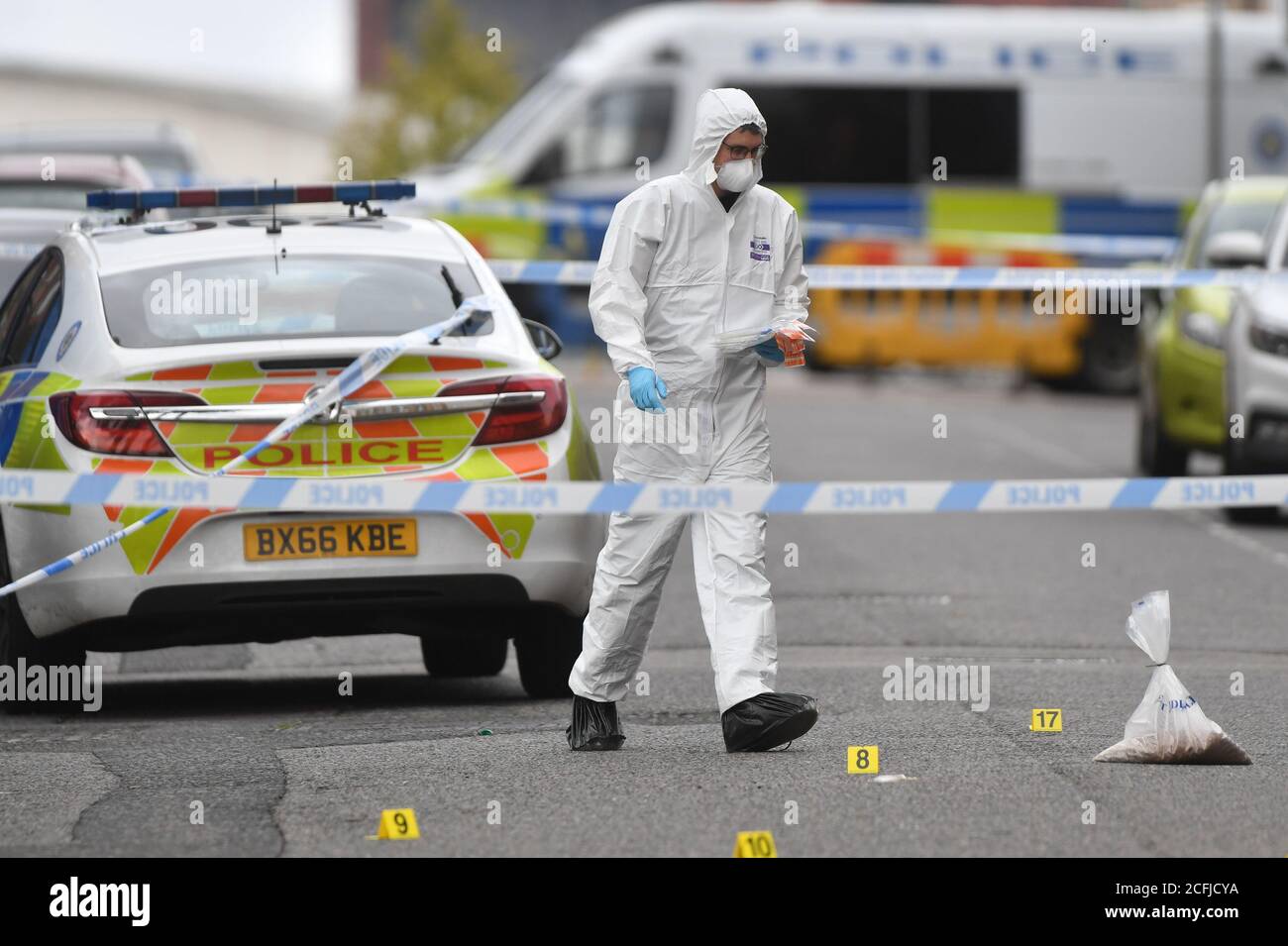 A police forensics officer in overalls in irving street hi-res stock ...
