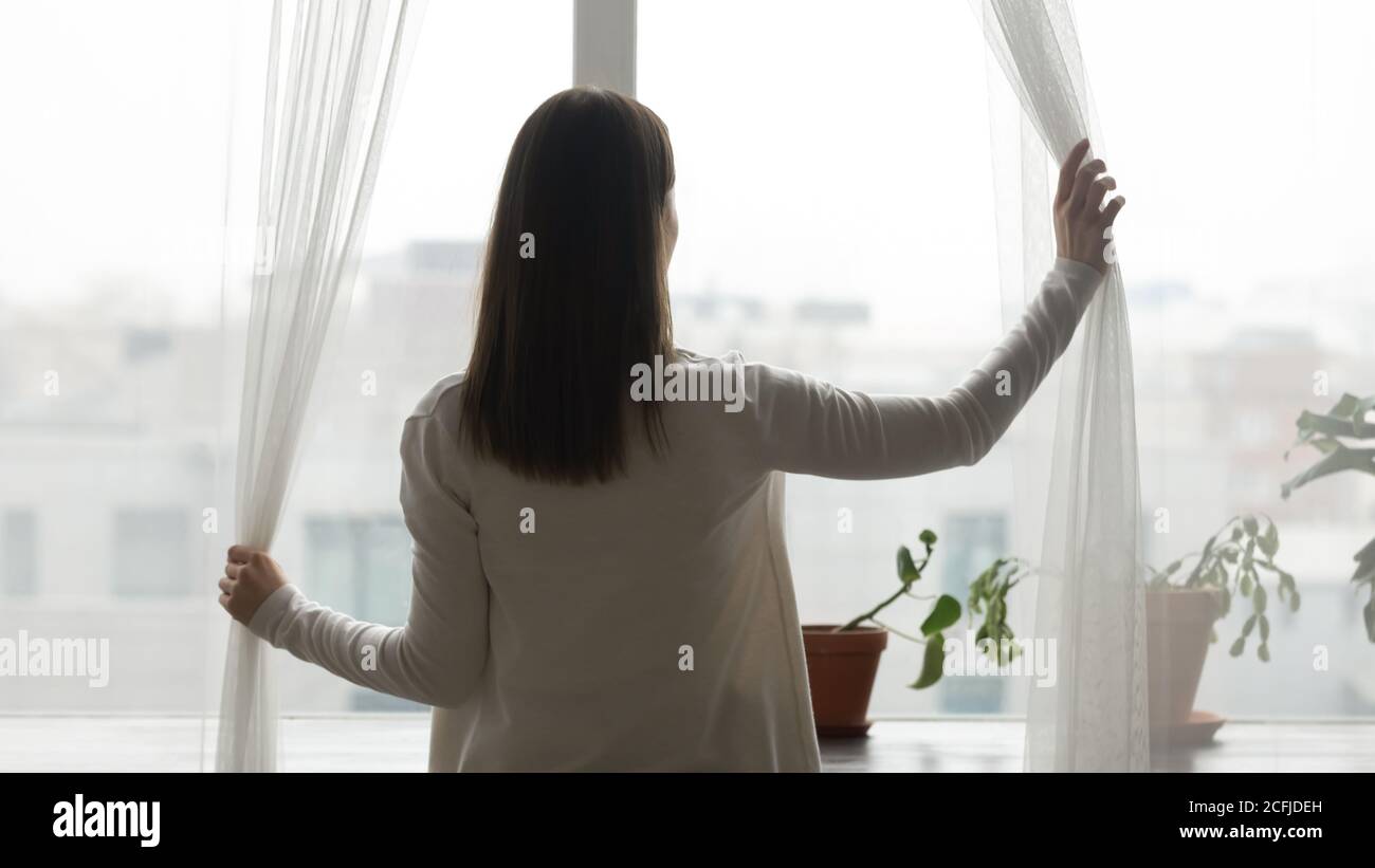 Female young looking look window back hi-res stock photography and ...