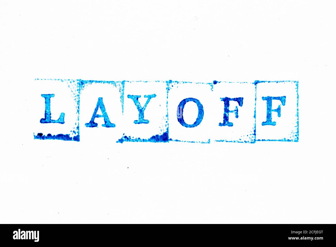 Blue color ink of rubber stamp in word layoff on white paper background ...