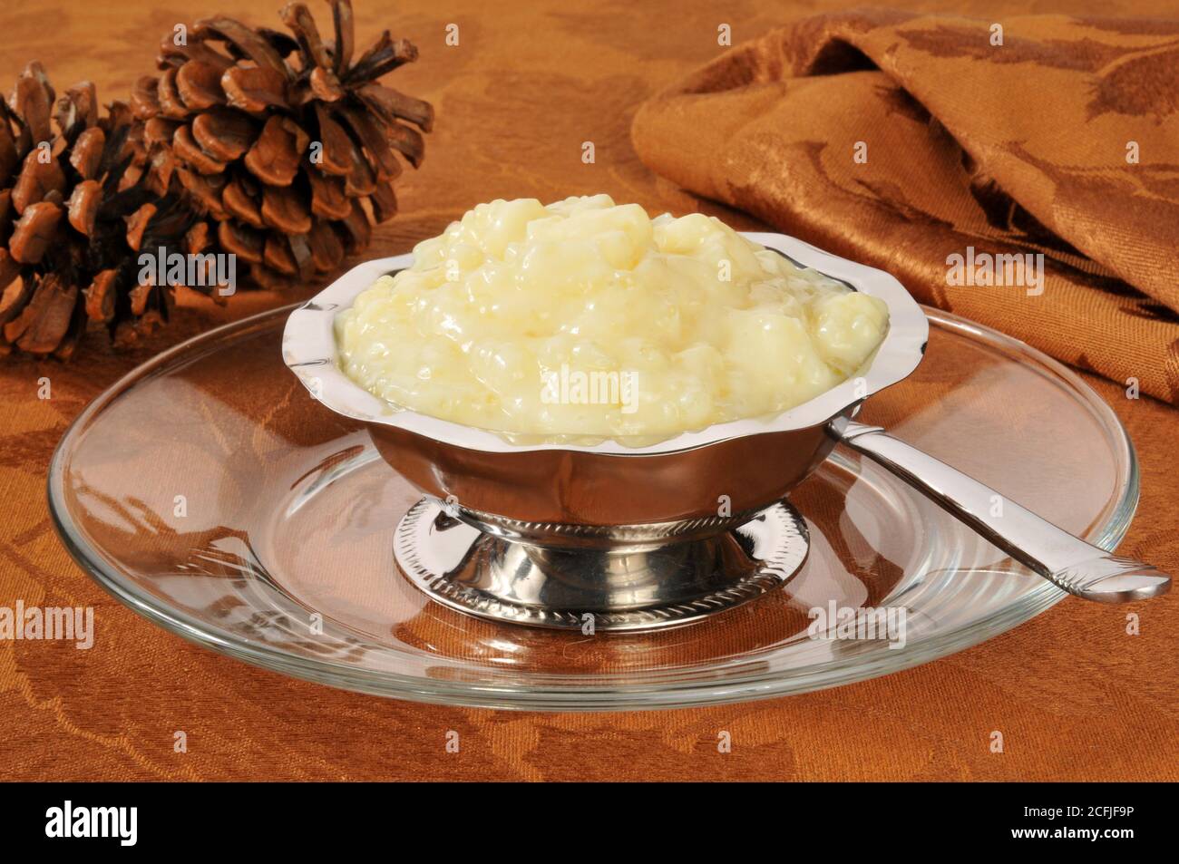A silver dessert bowl of tapioca pudding Stock Photo - Alamy