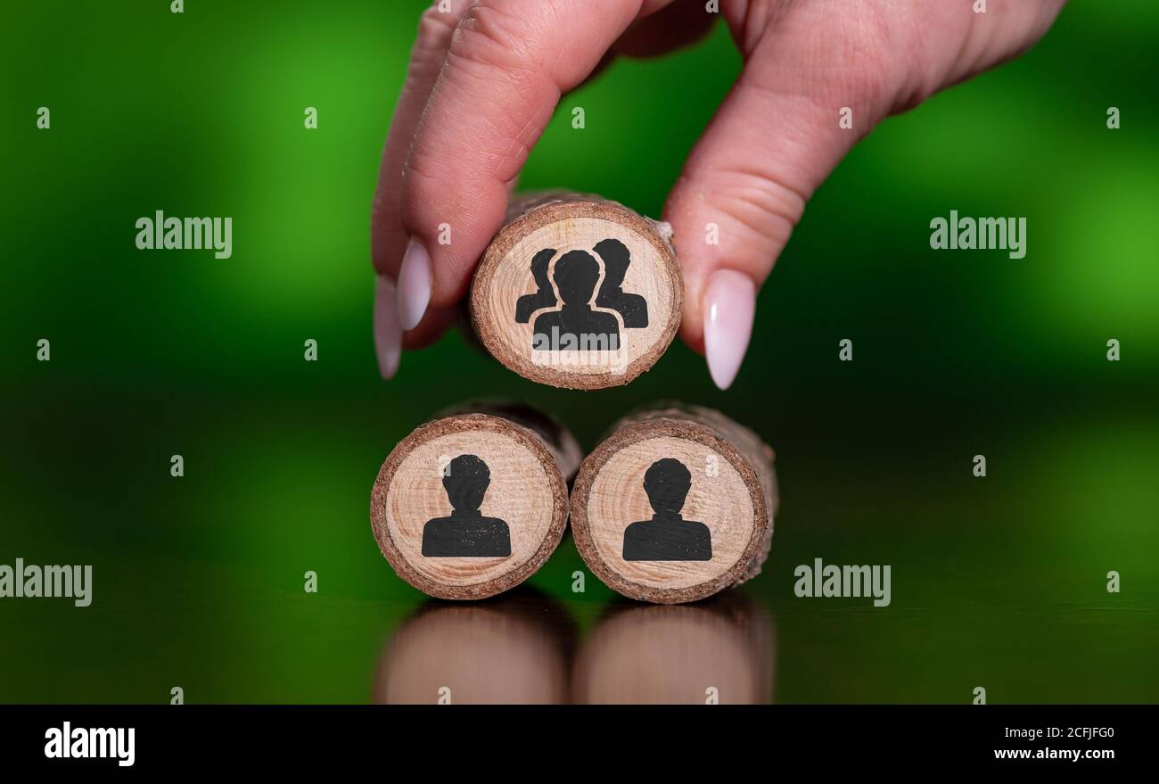 Concept of teamwork with icons on wooden logs Stock Photo - Alamy