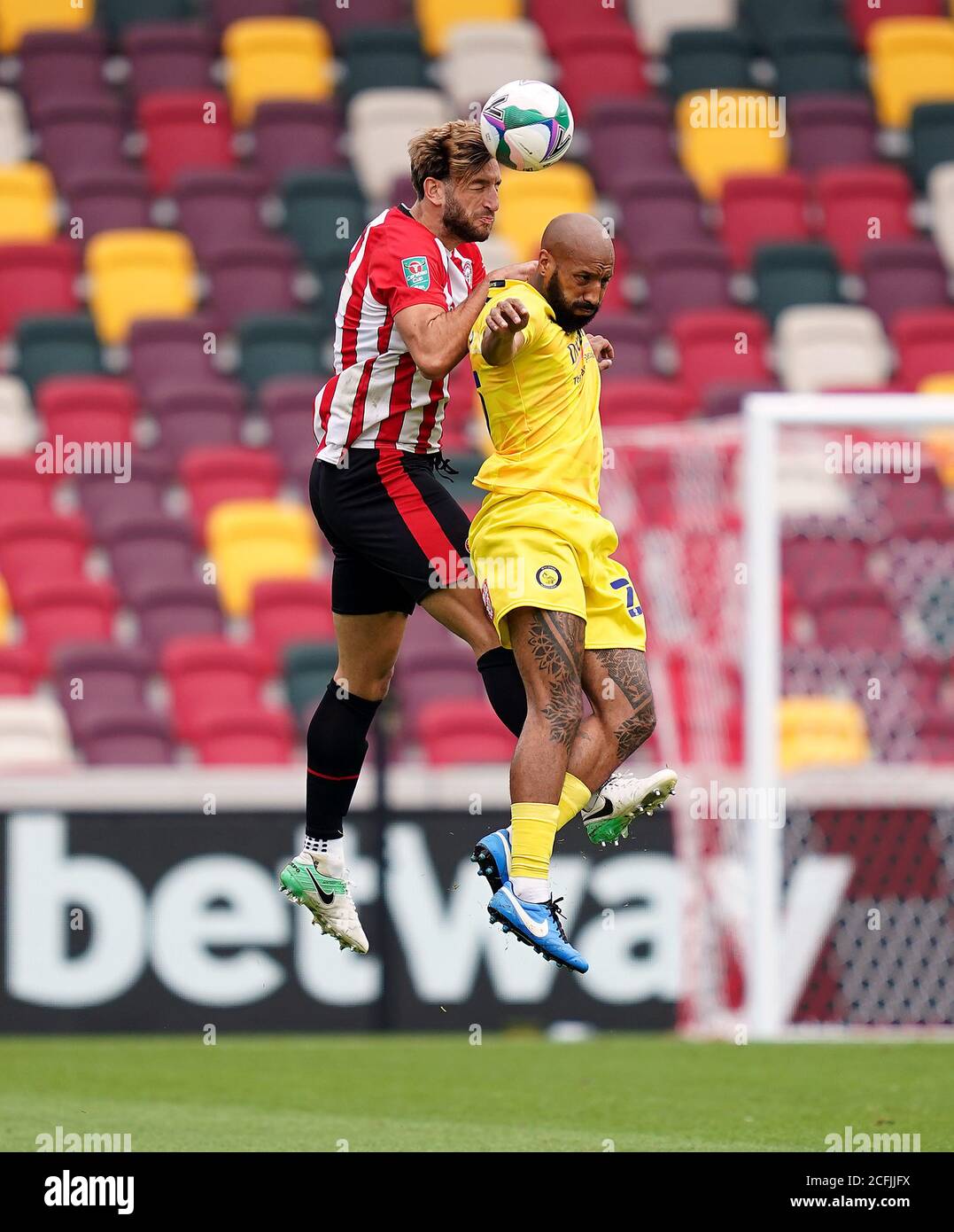 Brentford's Charlie Goode (left) and Wycombe Wanderers' Josh Parker ...