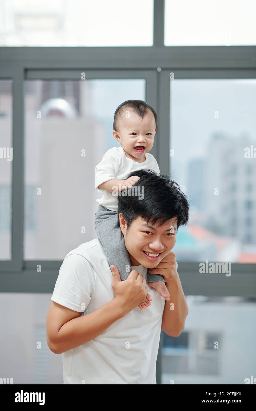 Happy father carrying daughter Stock Photo - Alamy
