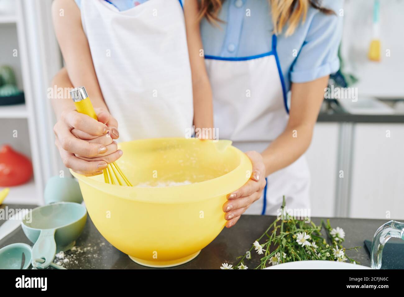 Child mixing flour and eggs hi-res stock photography and images - Alamy