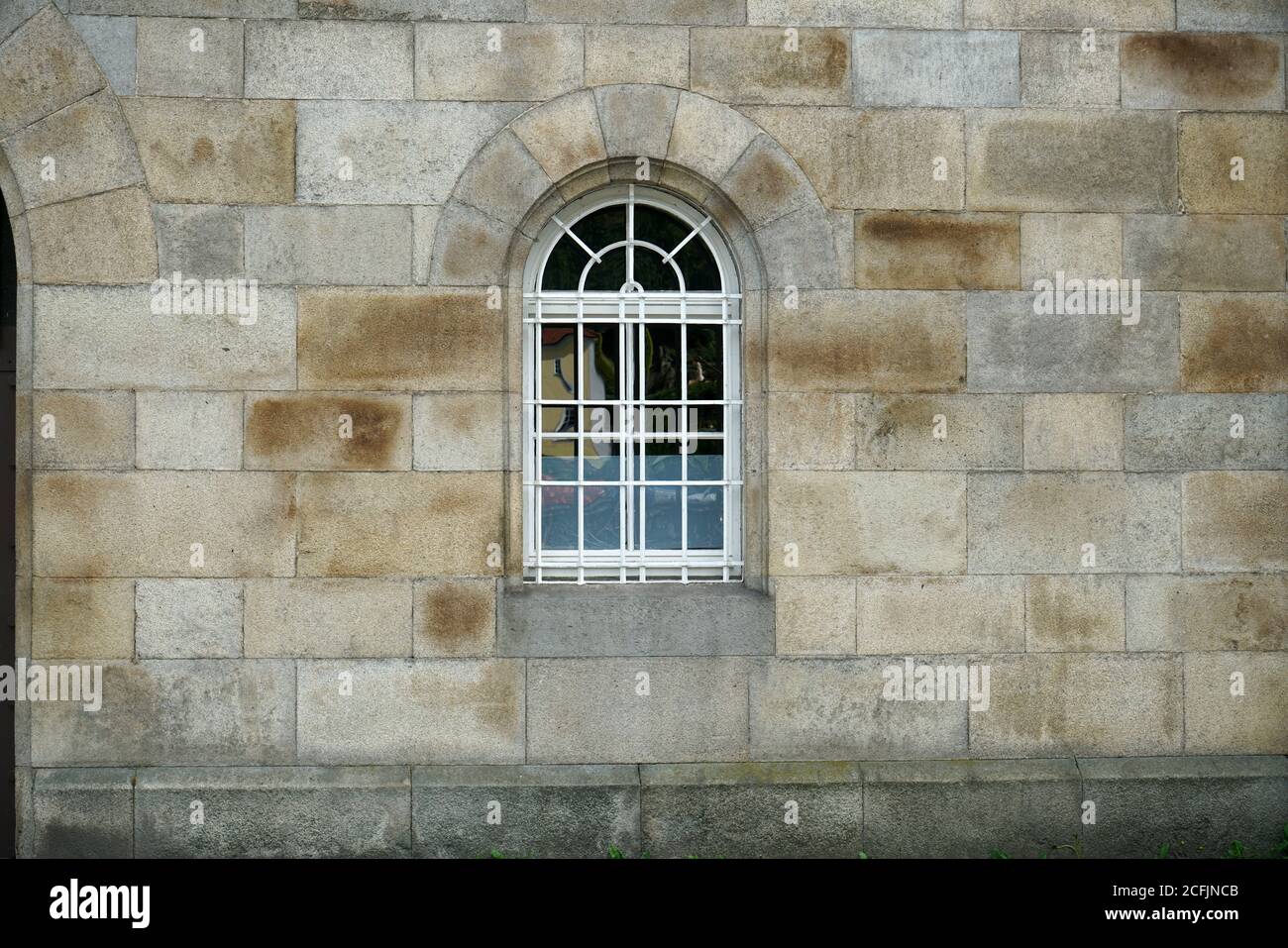 Old wall made of cement blocks with a glass window Stock Photo - Alamy