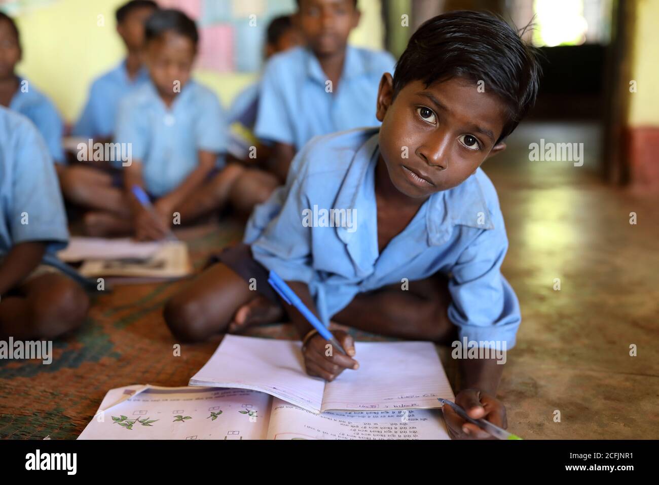 Tribal boys in primary school in a rural village in Odisha, India Stock ...