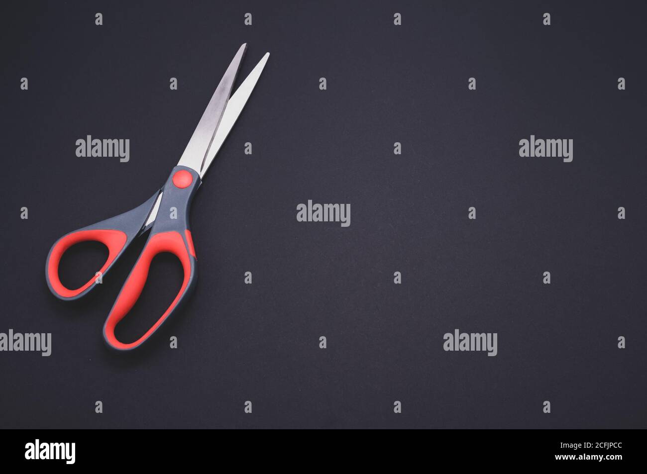 Top view of scissors isolated on a black background Stock Photo - Alamy